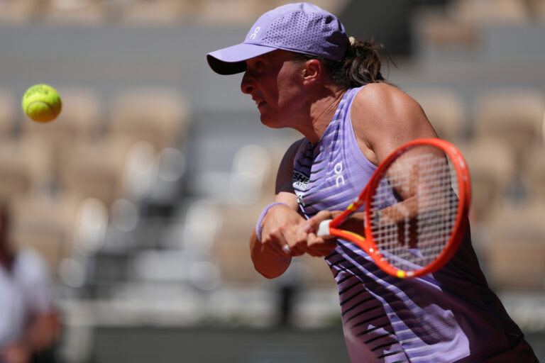 Iga Swiatek improves career record at French Open to 42-3 as she ...